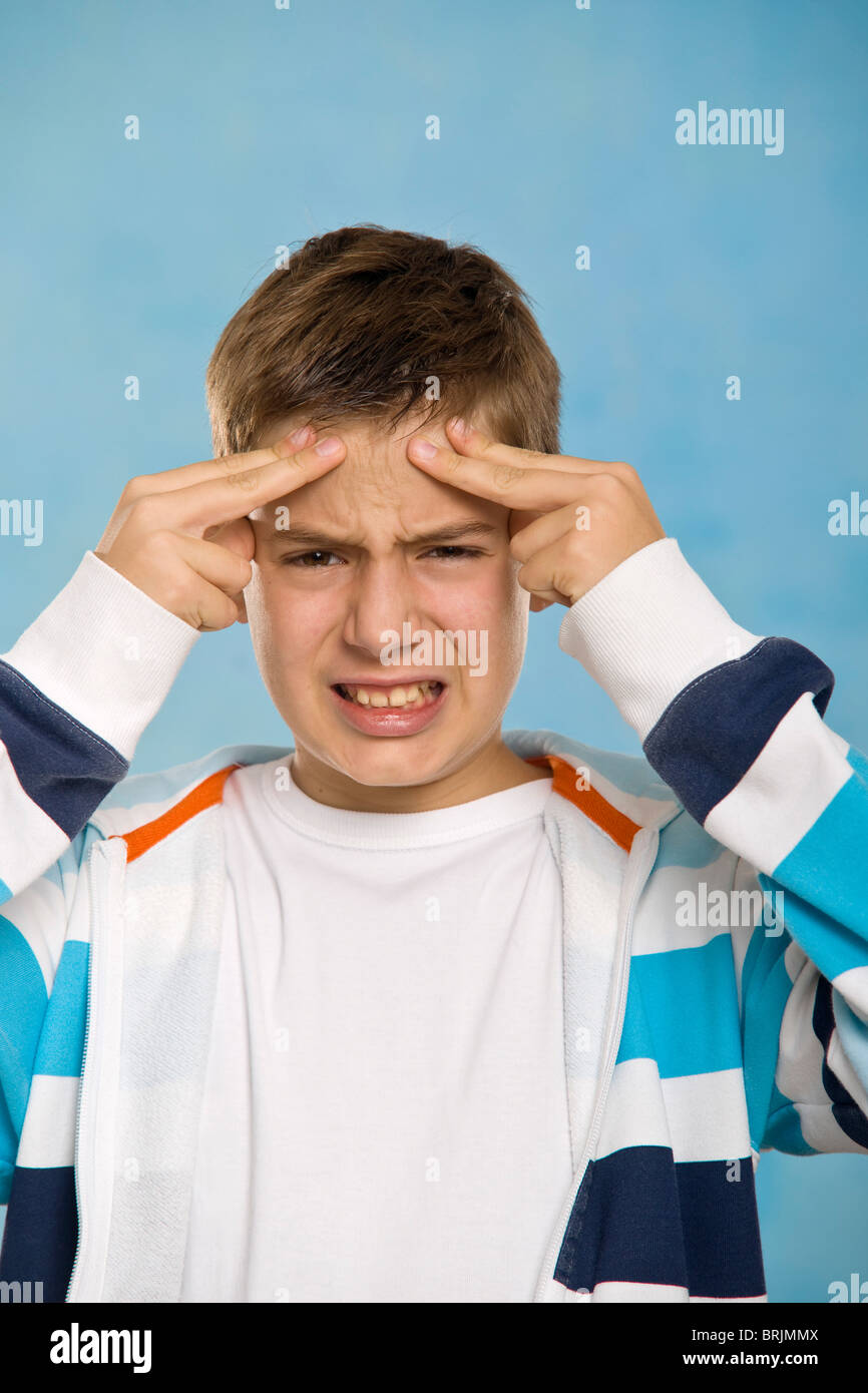 Boy Touching Forehead Stock Photo - Alamy
