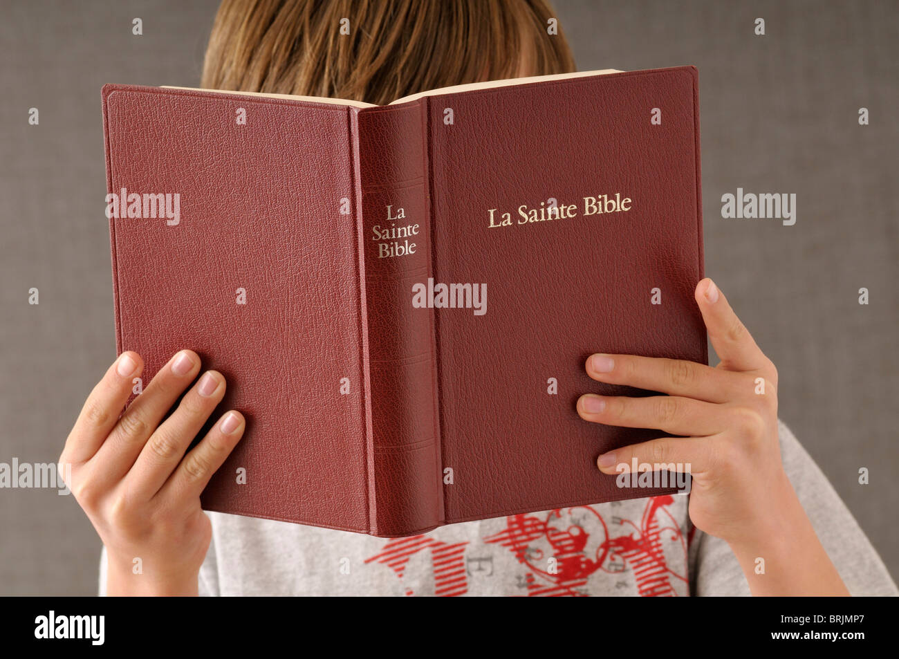 Boy reading bible hi-res stock photography and images - Alamy