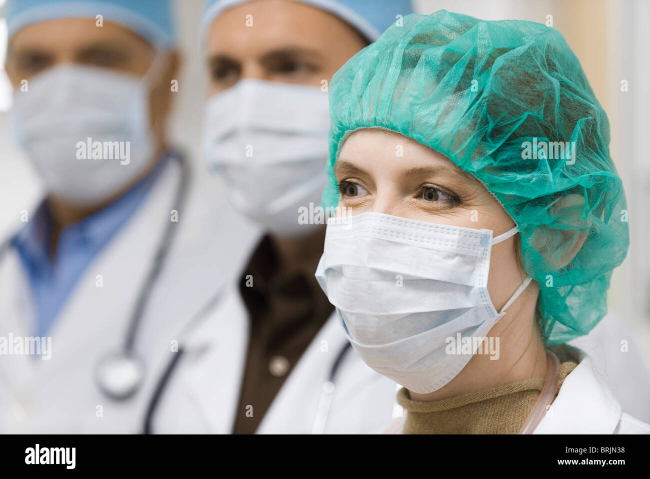 Doctors wearing surgical masks Stock Photo - Alamy