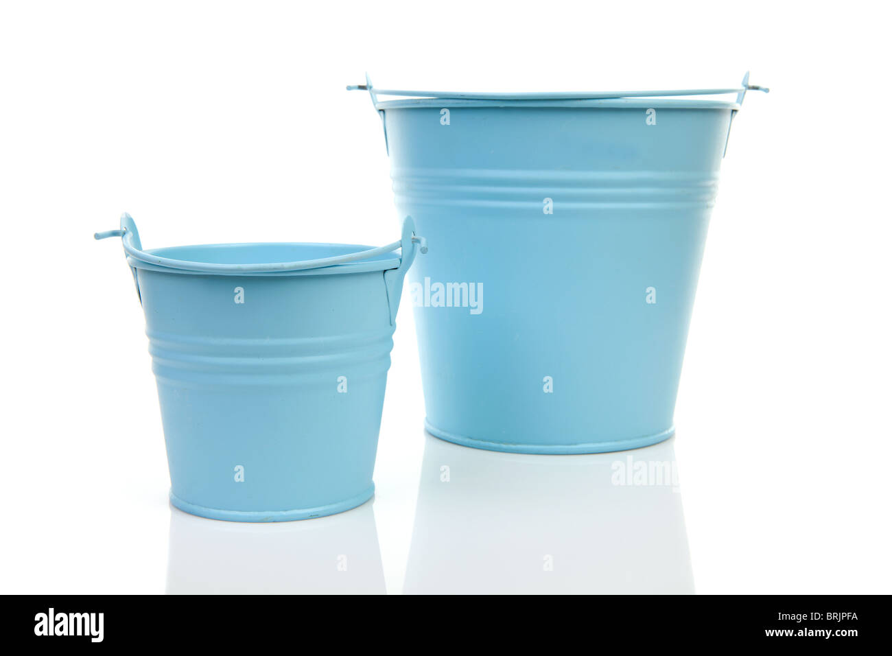 two empty blue buckets over white background Stock Photo - Alamy