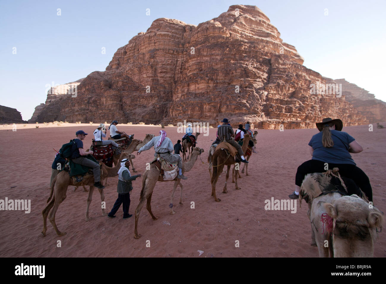 Camel riders in sandy hi-res stock photography and images - Alamy