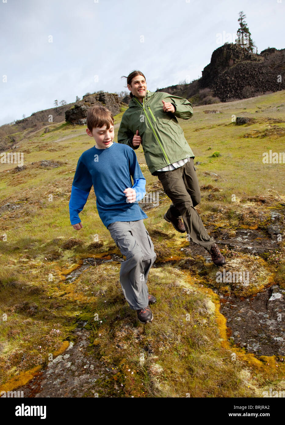 A man and boy on a hike together Stock Photo - Alamy