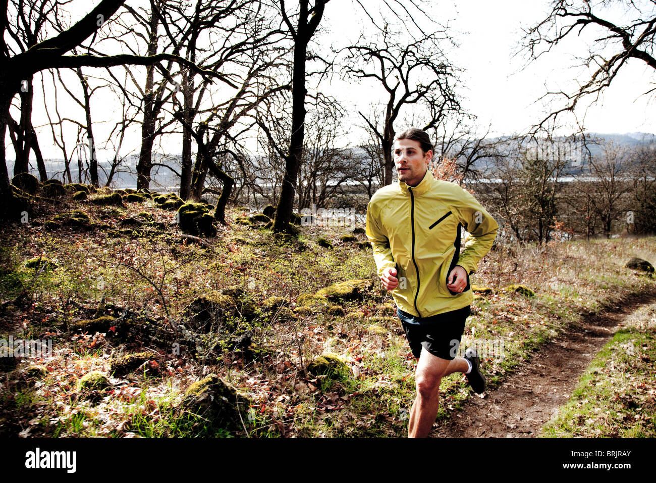 A fit man out trail running Stock Photo - Alamy