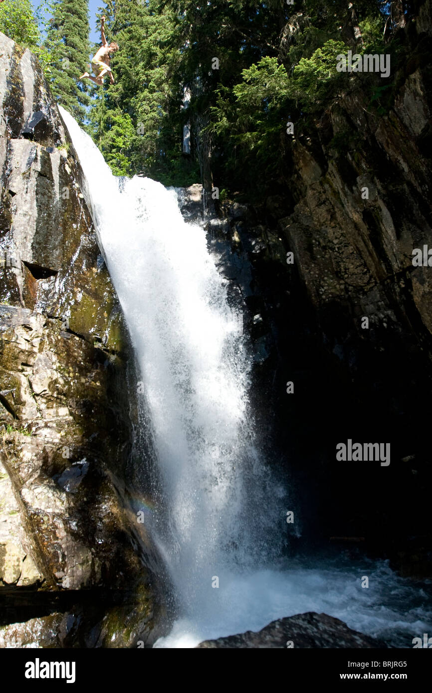 Man jumping off waterfall in Idaho Stock Photo - Alamy