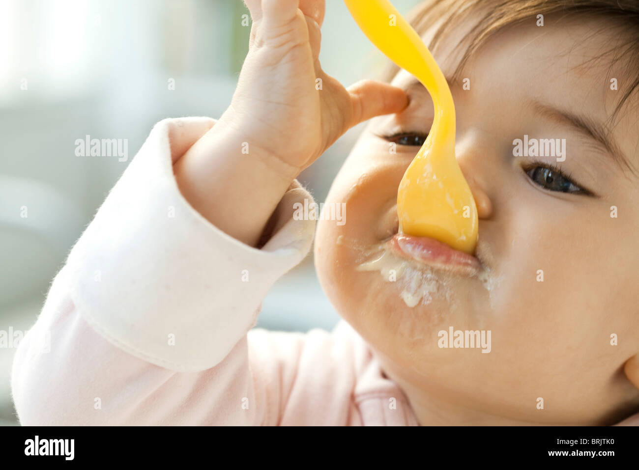 Infant learning eat spoon hi-res stock photography and images - Alamy