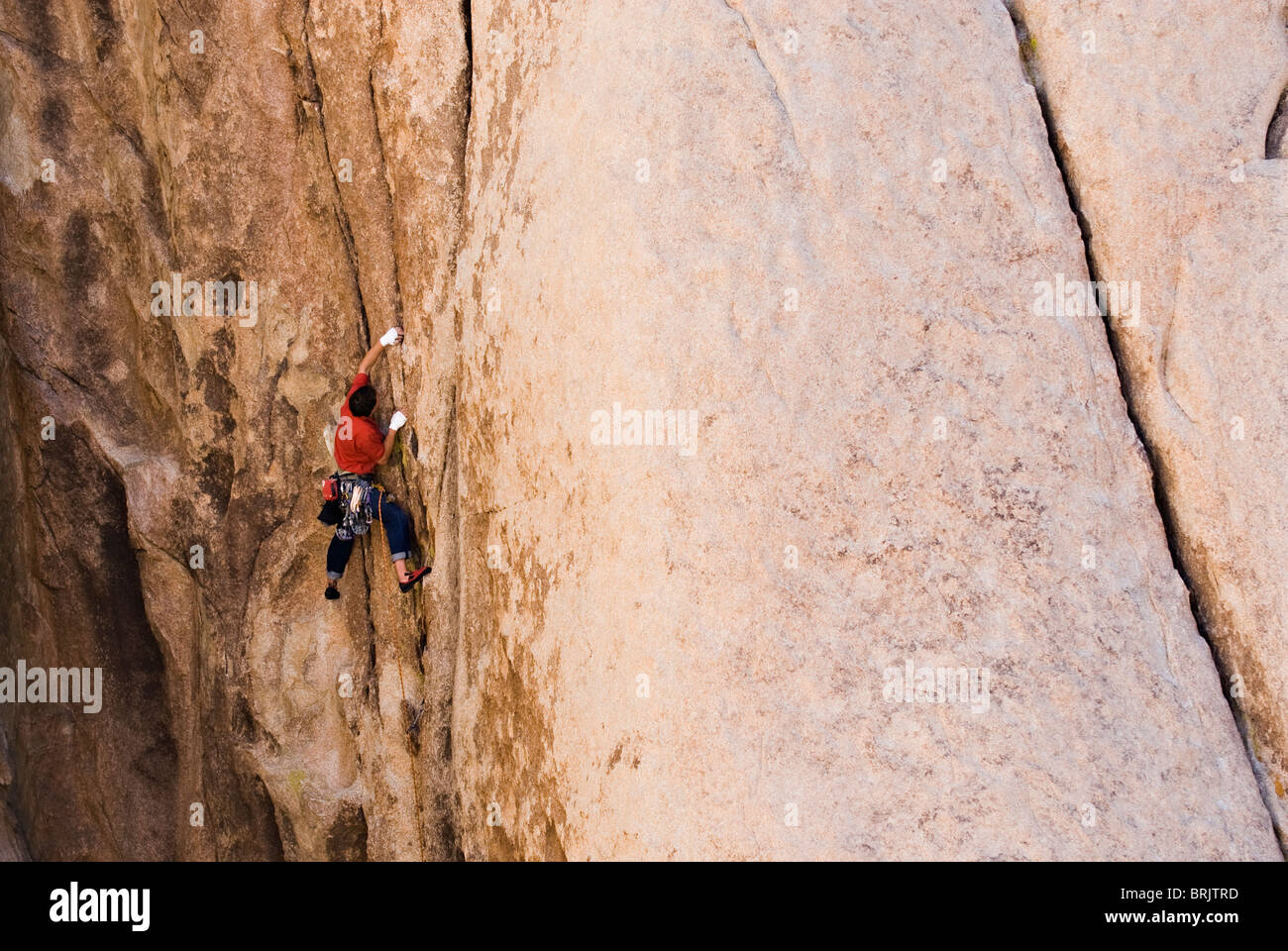 A young man climbing a long crack Stock Photo - Alamy
