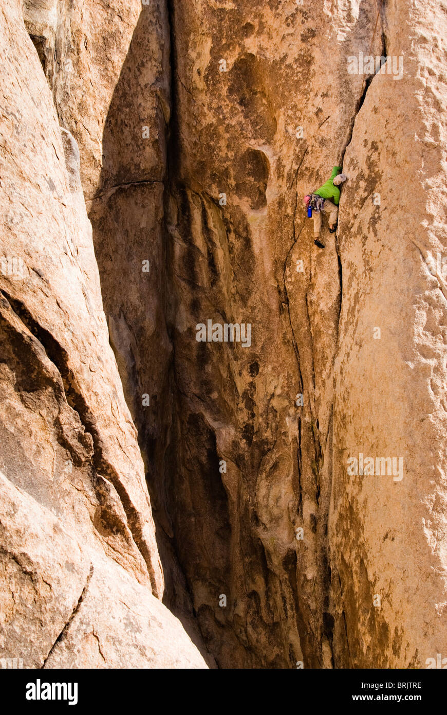 A young man climbing a long crack Stock Photo - Alamy
