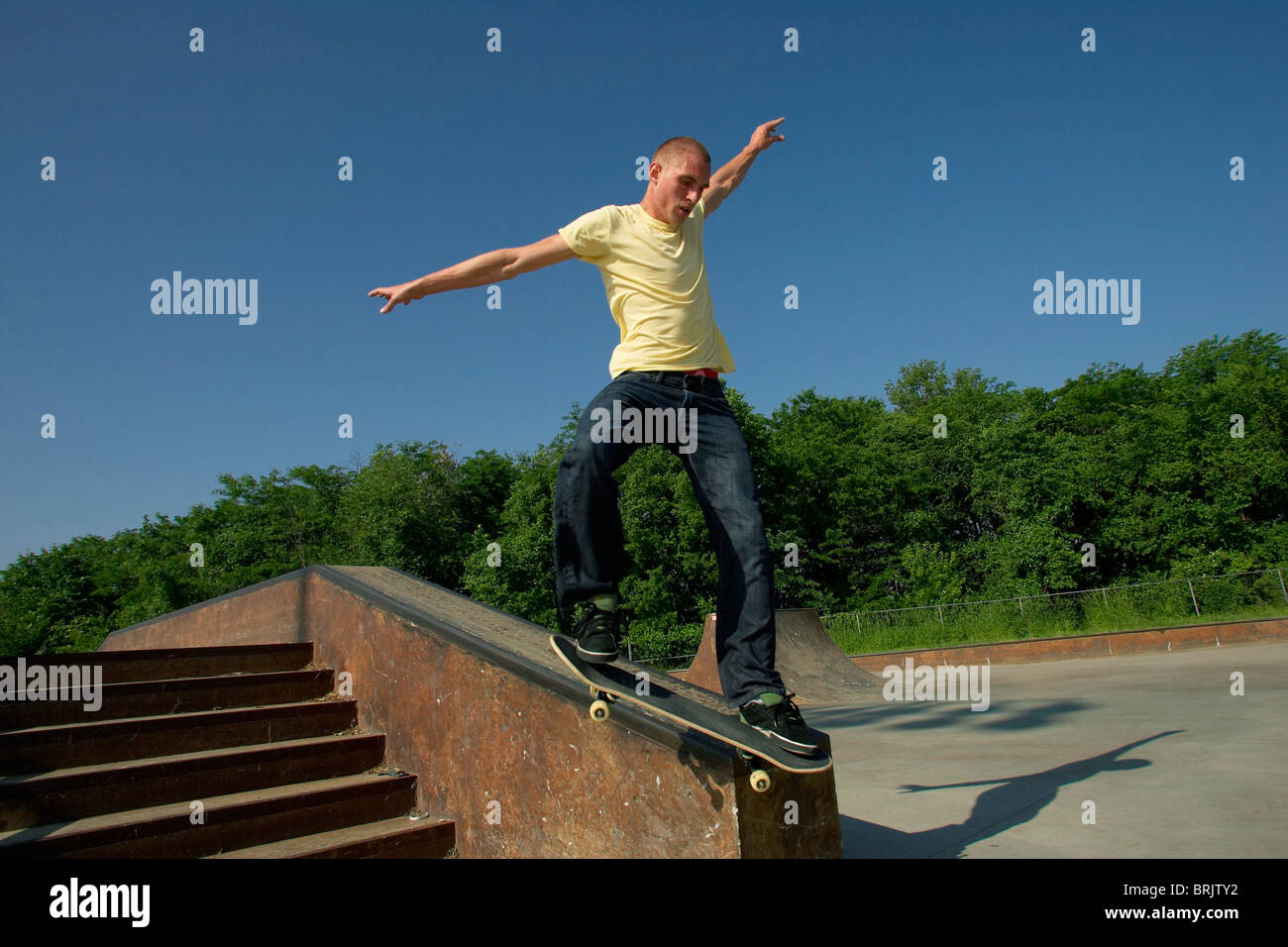 Skateboarder doing tricks at a skate park Stock Photo - Alamy
