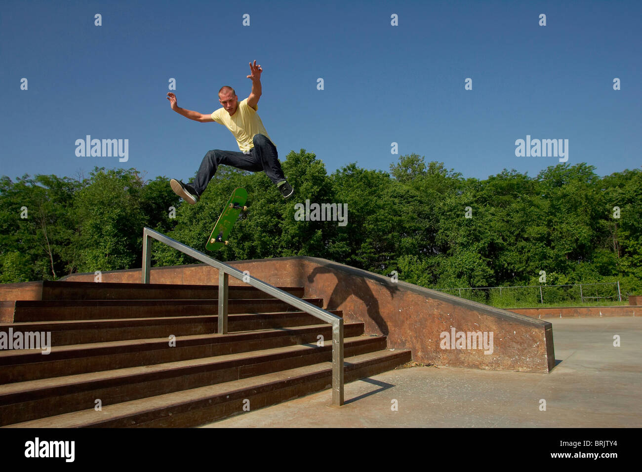 Skateboarder doing tricks at a skate park Stock Photo - Alamy