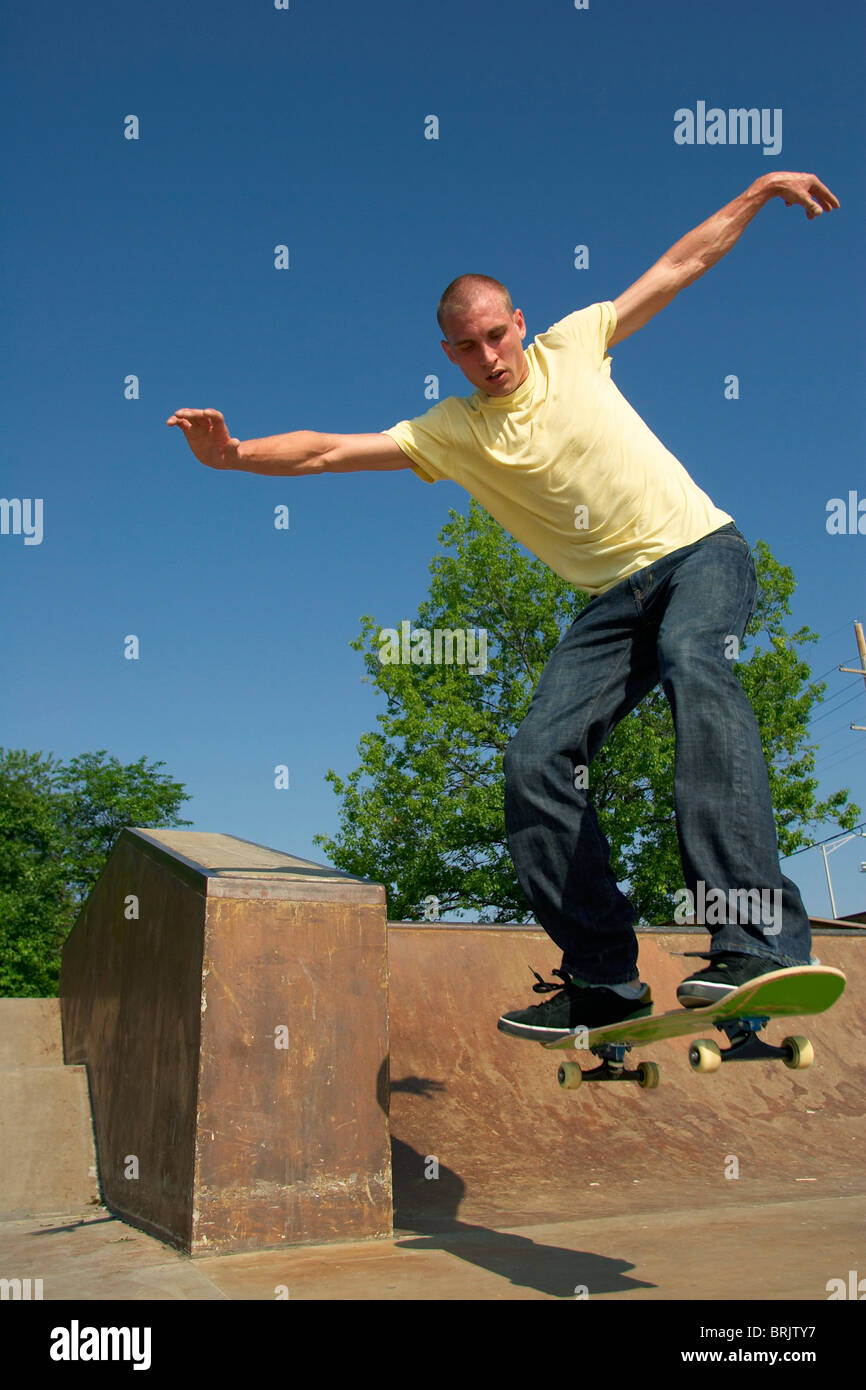 A skateboarder doing tricks at a skate park Stock Photo - Alamy