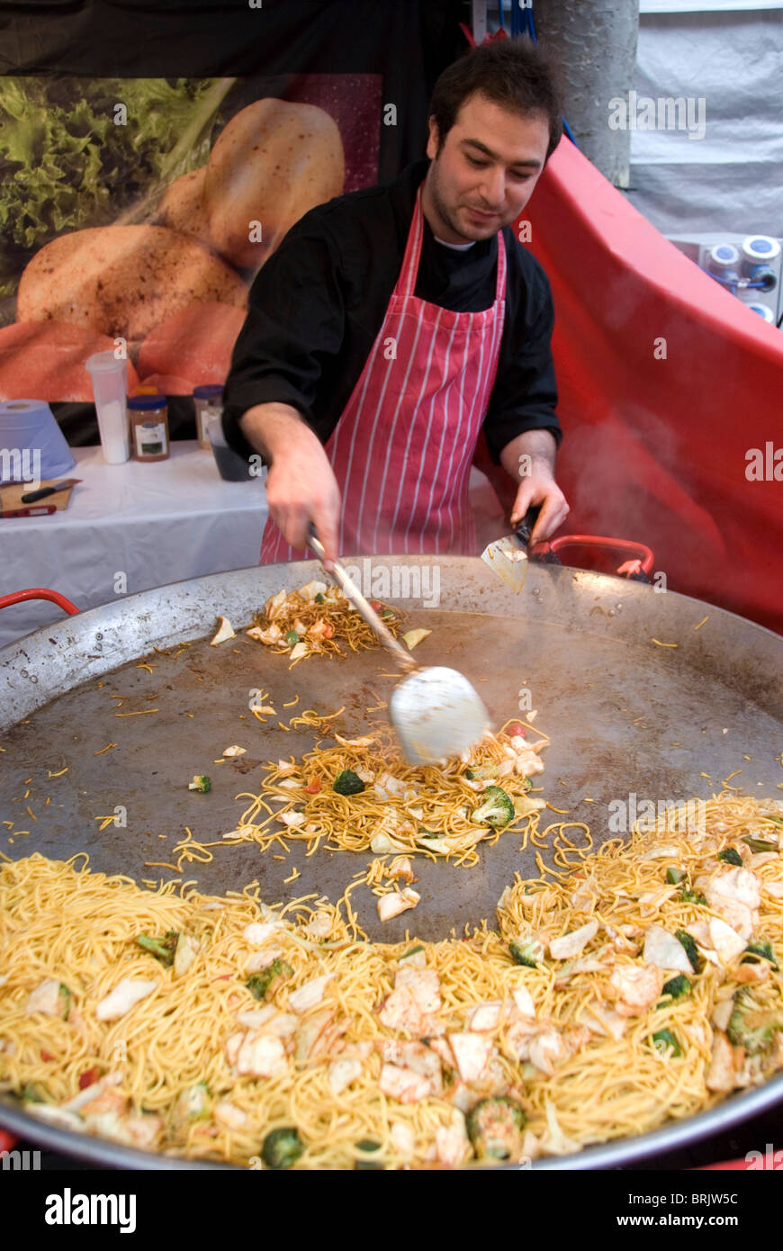 Man selling stir-fried vegetable noodles at the York International ...