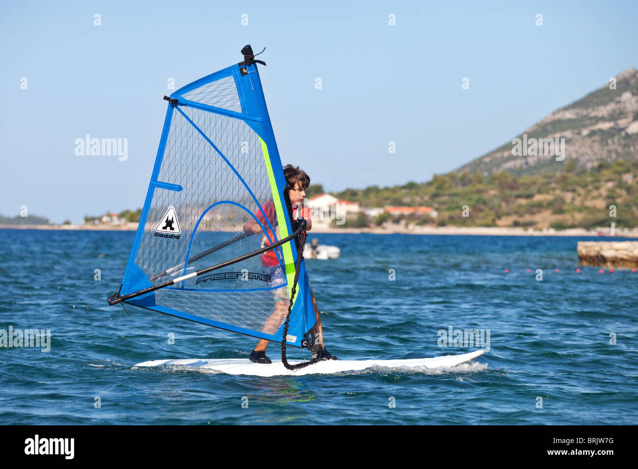 A child windsurfing Stock Photo - Alamy