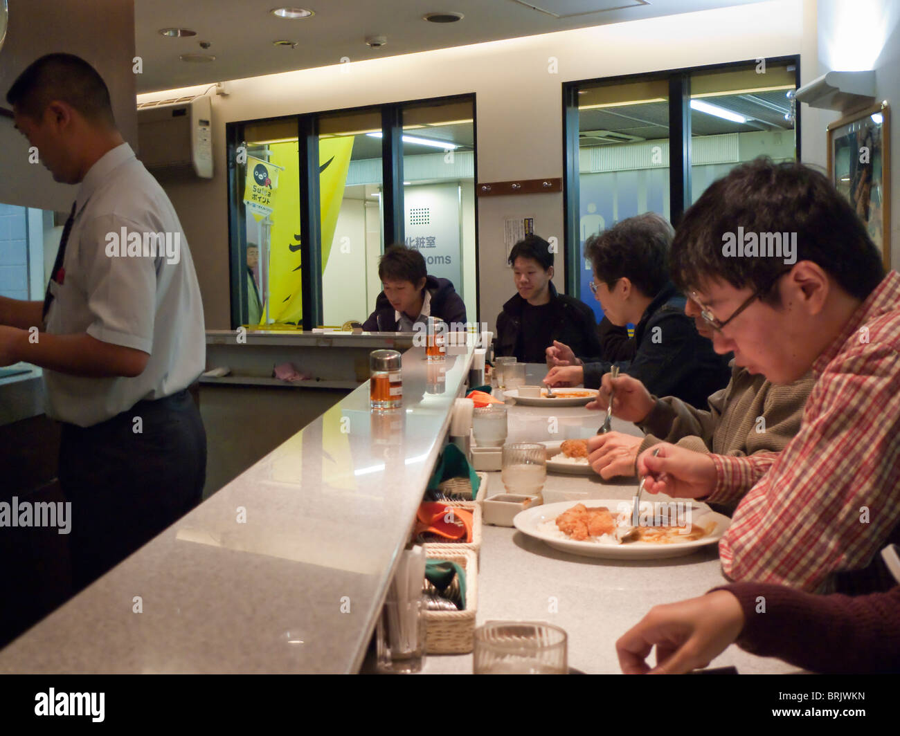 People eating in a curry restaurant in Tokyo station. Japan Stock Photo ...