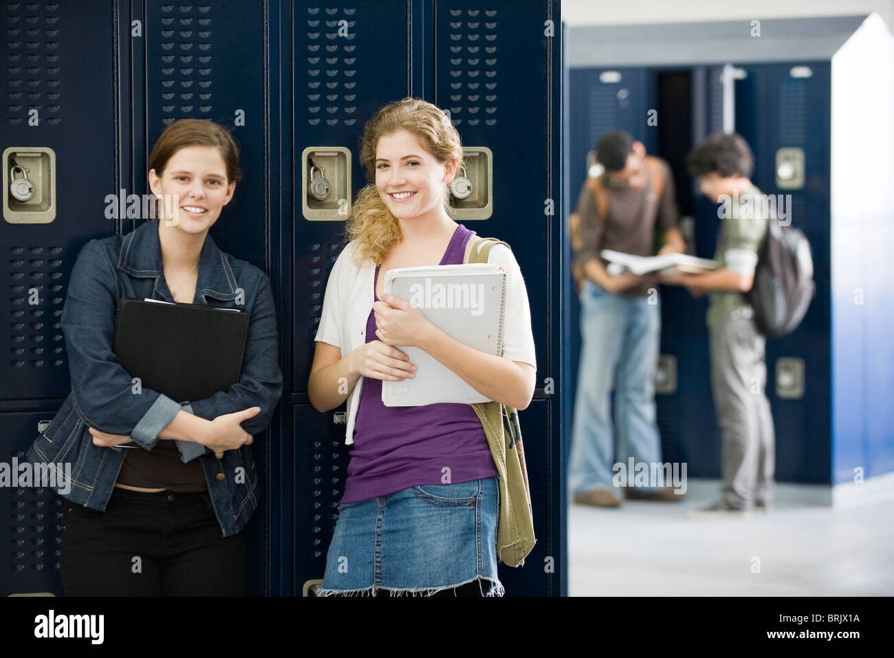 High school friends together by lockers, portrait Stock Photo - Alamy