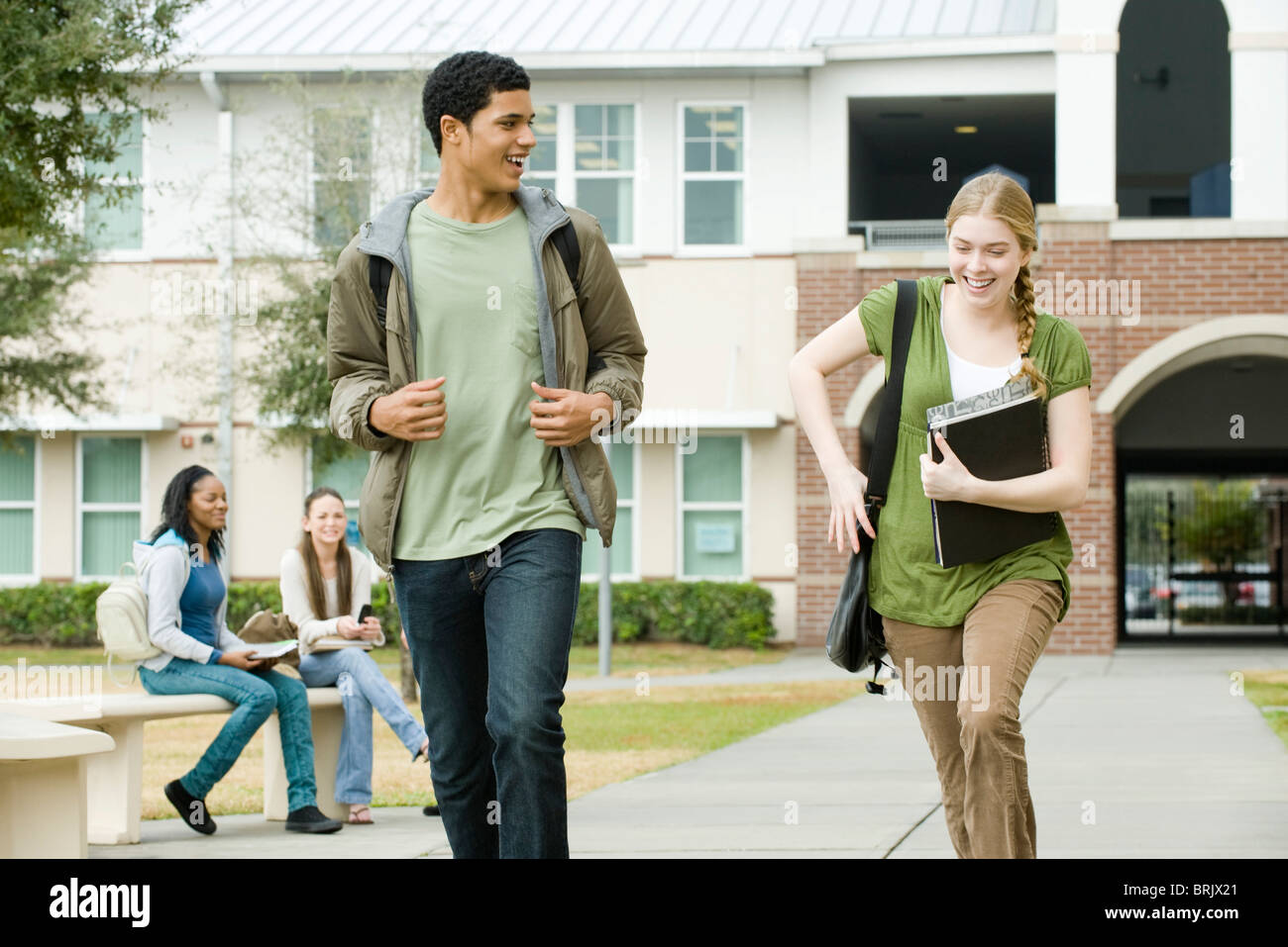 High school friends walking together on campus Stock Photo - Alamy
