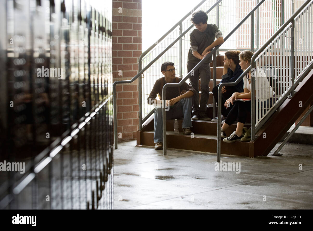 High school friends chatting together Stock Photo - Alamy