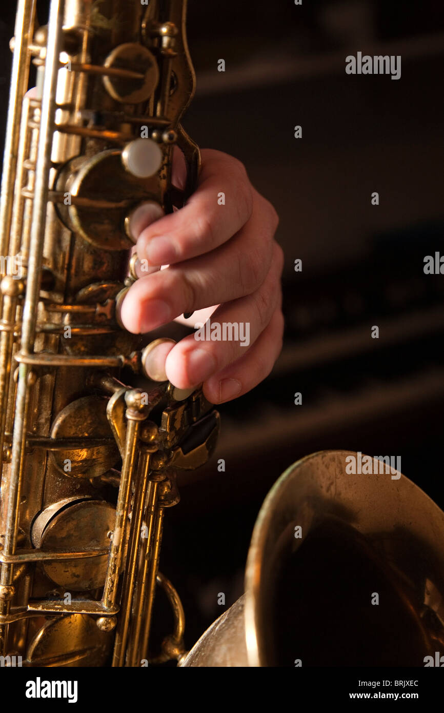 Hands on saxophone Stock Photo - Alamy