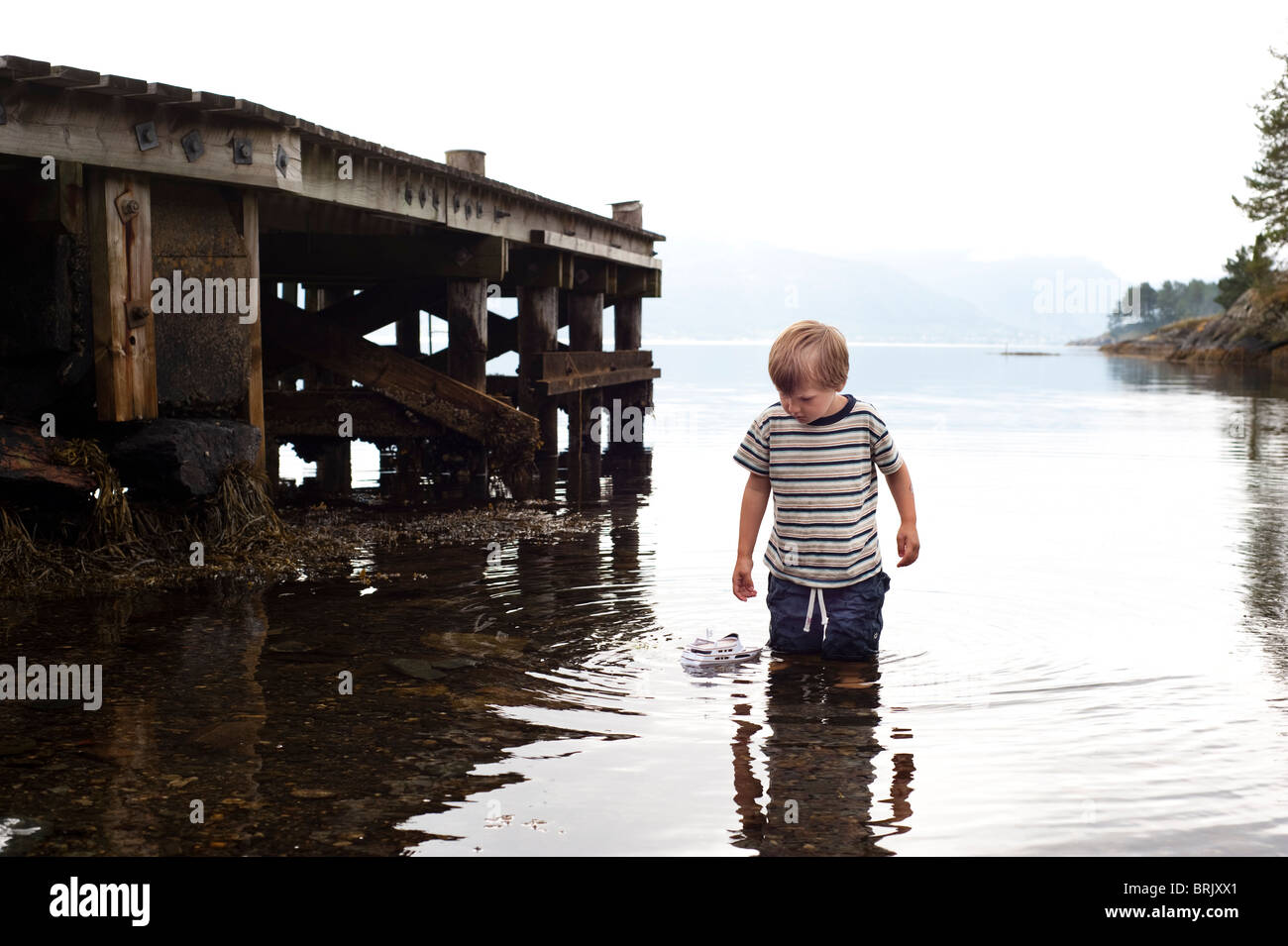 Boy playing toy boat hi-res stock photography and images - Alamy