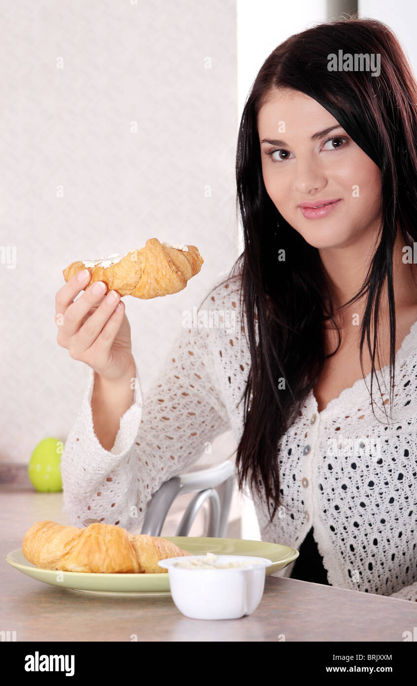 Young Adult Woman Eating Breakfast Stock Photo - Alamy