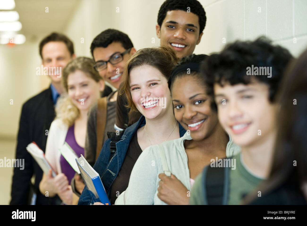 Line queue woman man boy teen teens teenager teenagers hi-res stock ...