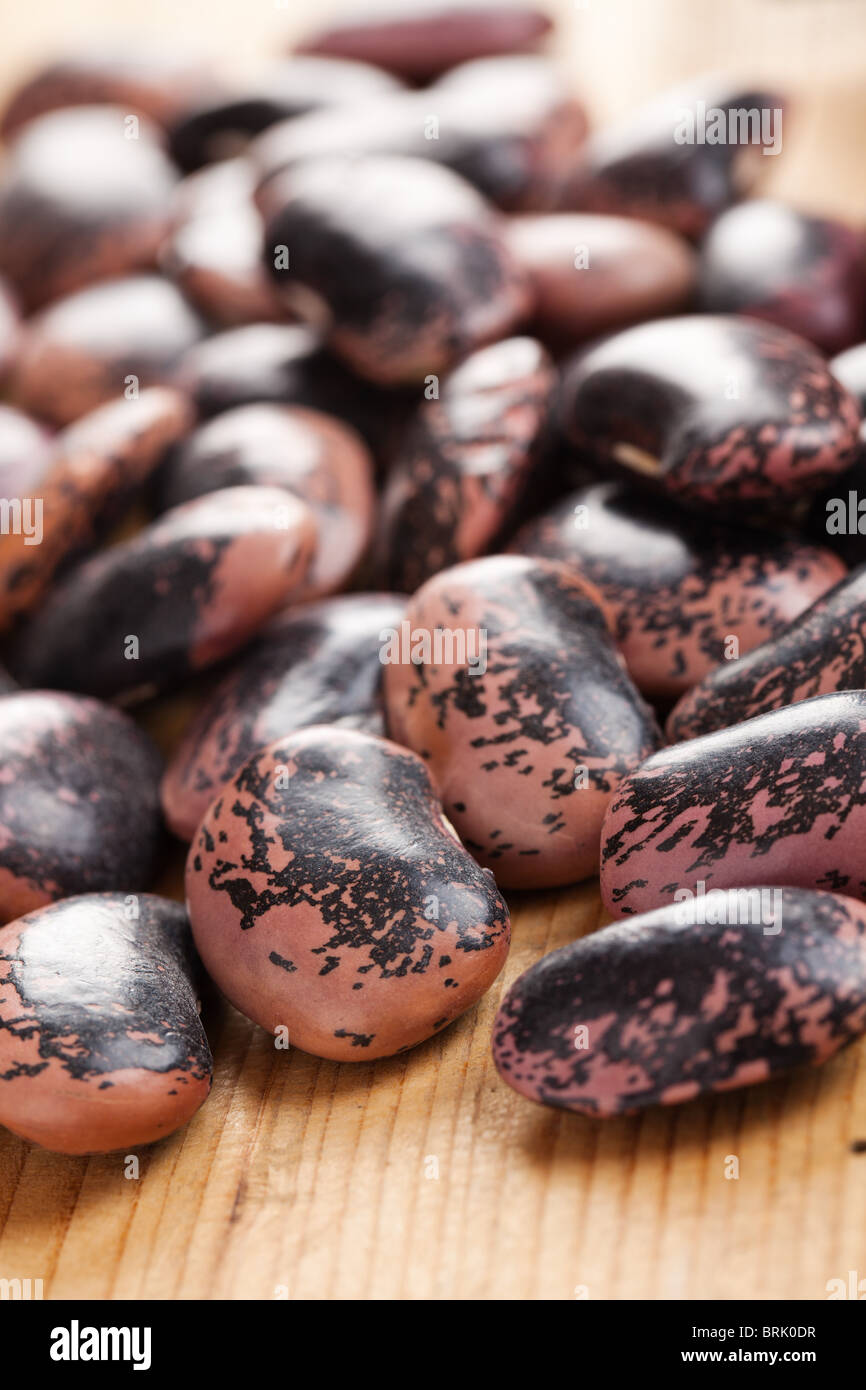 color beans on wooden table Stock Photo - Alamy