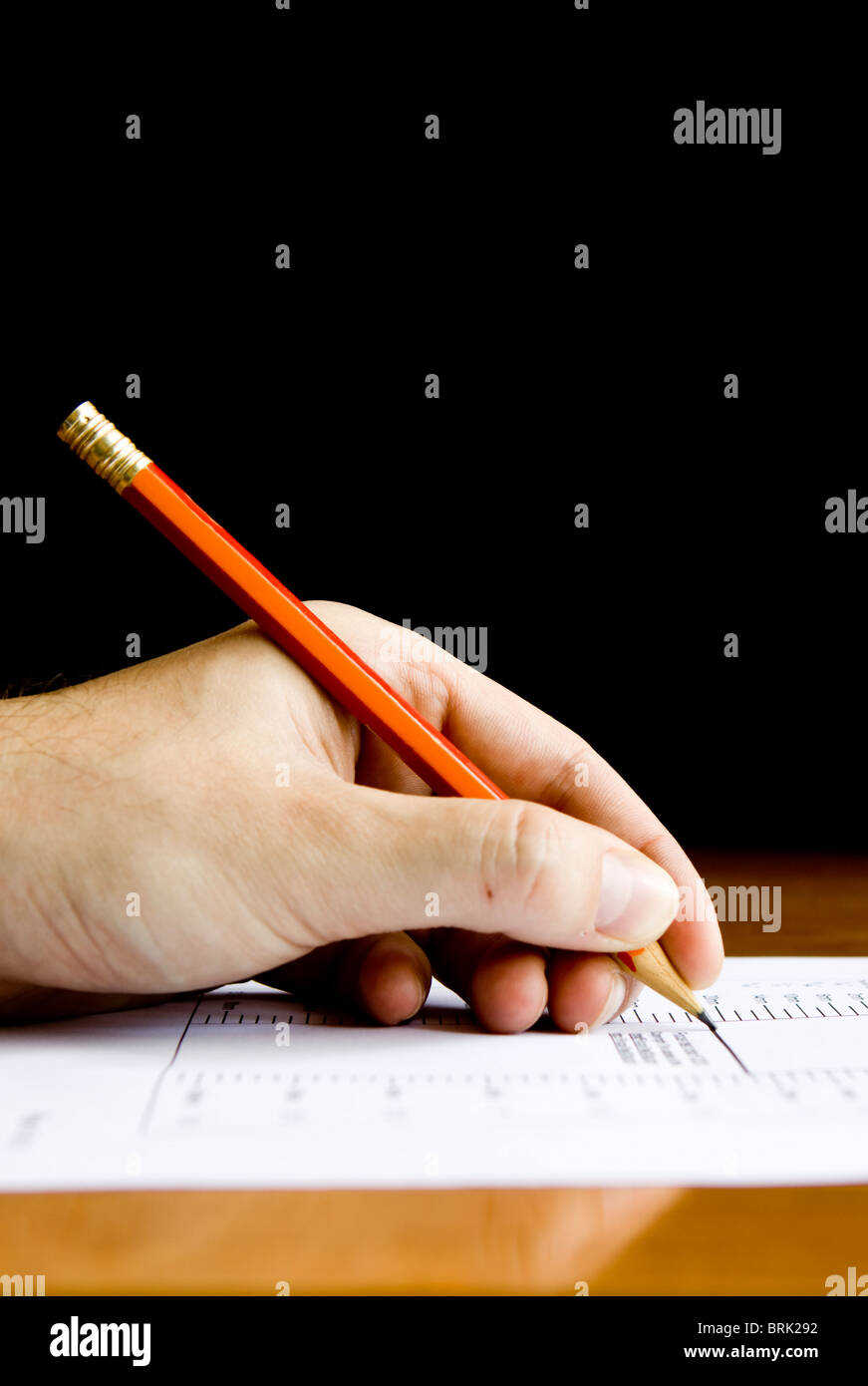 Close-up of hand with a pencil on some document. Much space for copy ...