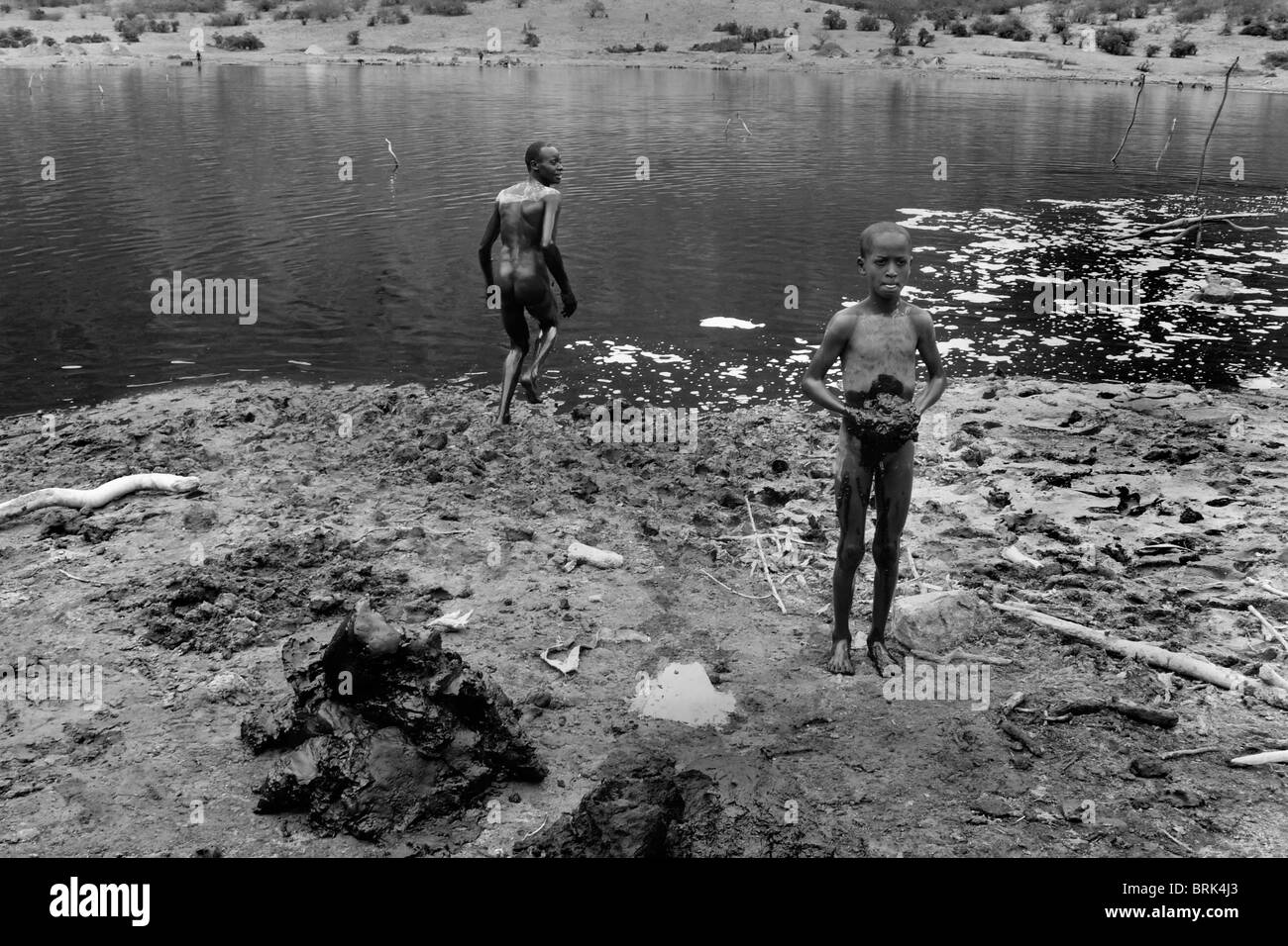 Child labor, young salt workers in the crater of El Sod, Etiopia Stock ...