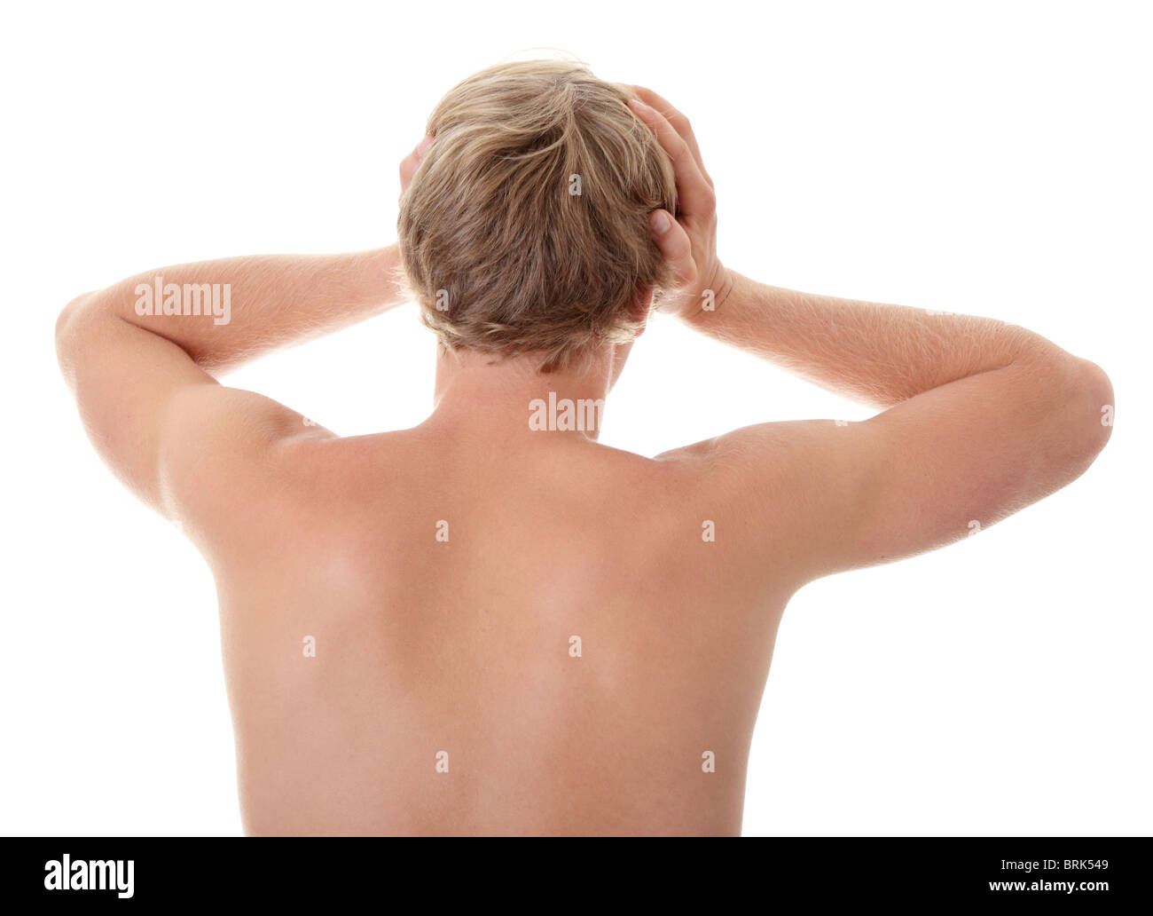 A young man grasping his head where the pain is - a killer headache or ...
