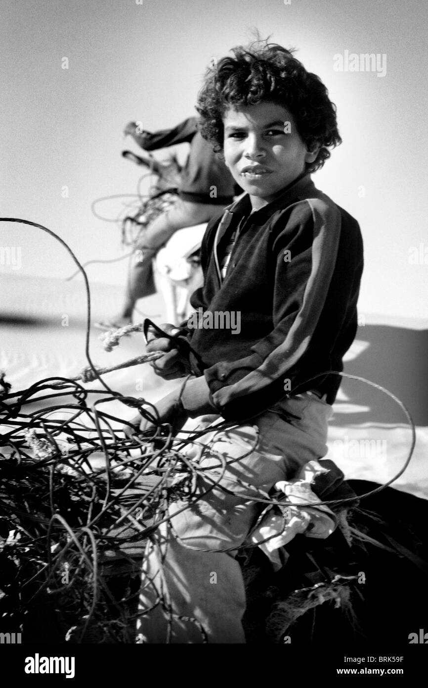 Child labor, young scrap collector, El Golea, Algeria Stock Photo - Alamy