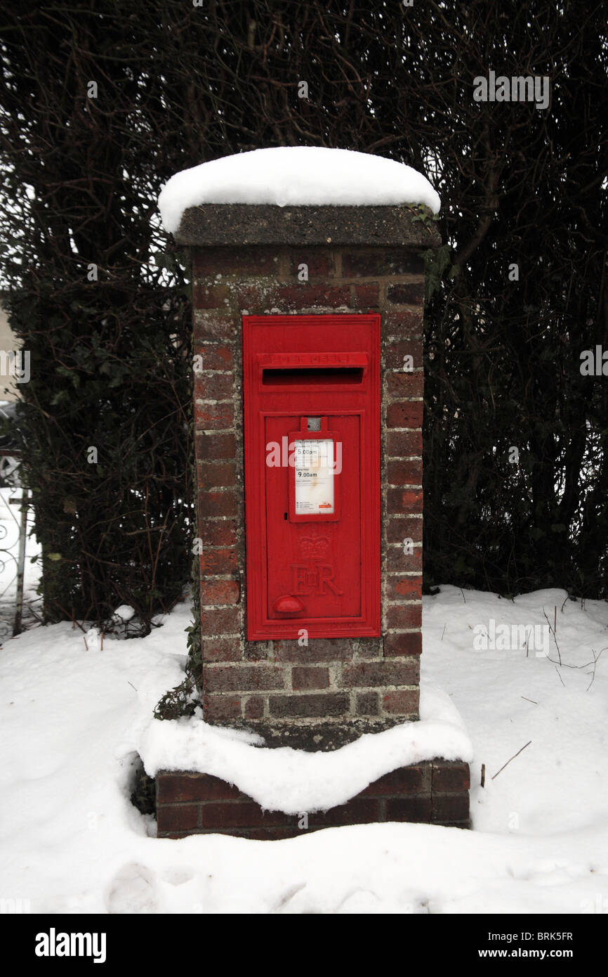 UK Post Office postbox covered in snow Stock Photo - Alamy