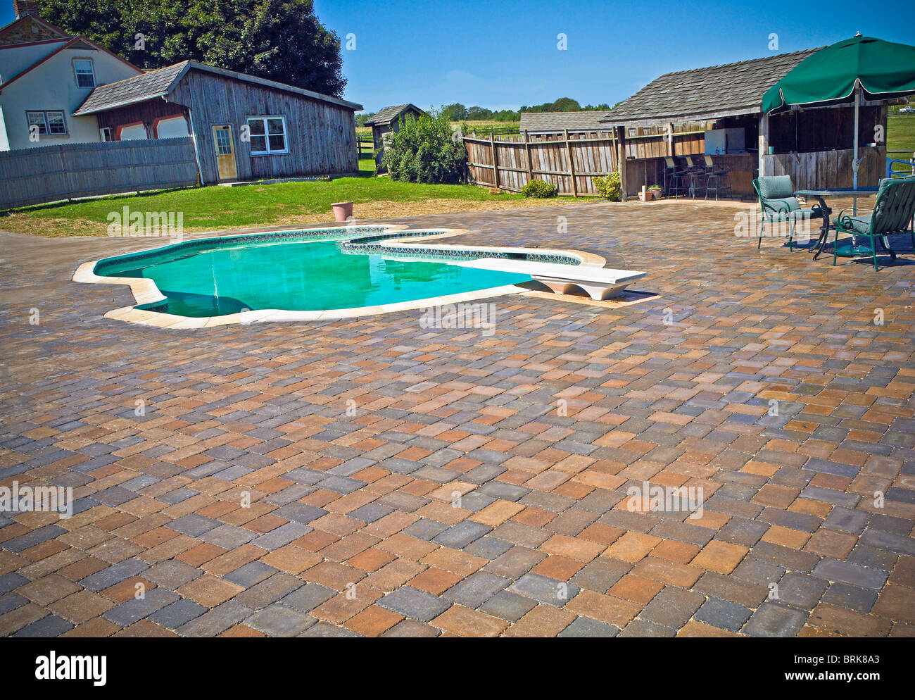 Brick stone patio swimming pool Stock Photo - Alamy