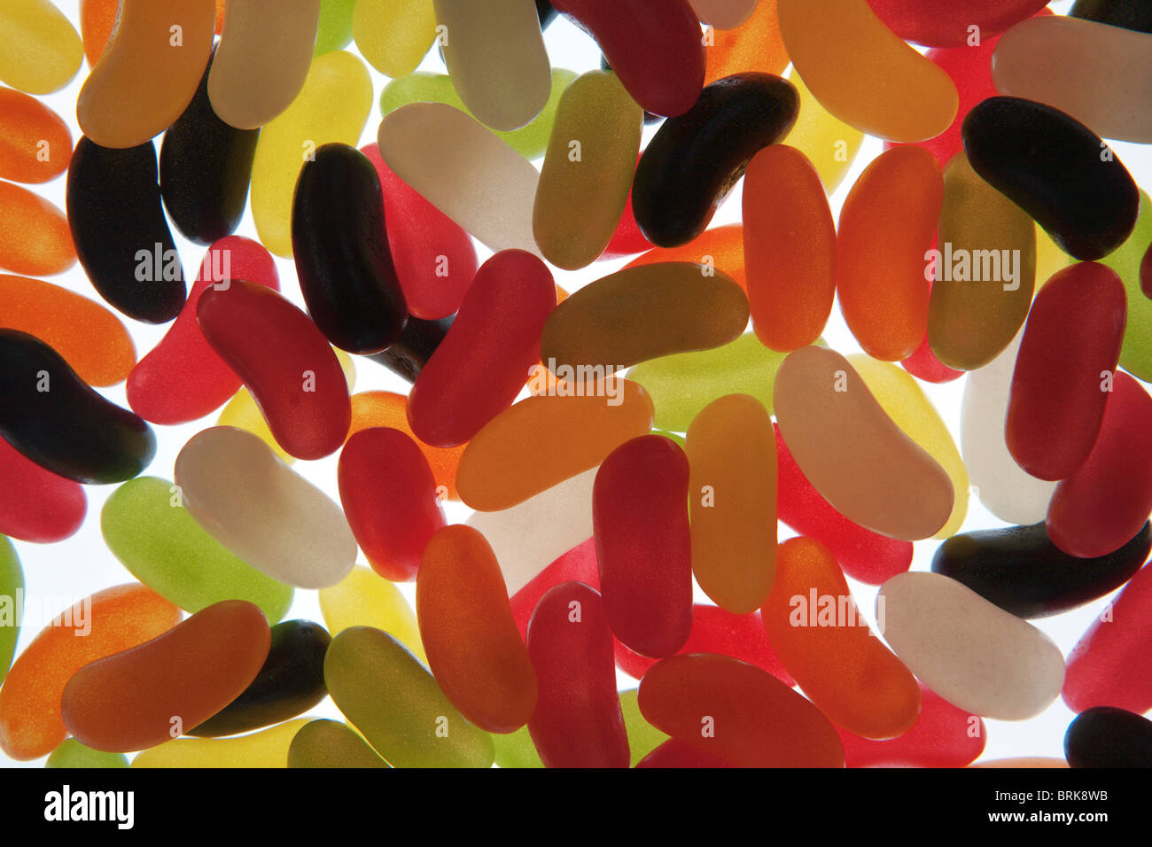 many jelly beans sweets on a white back ground Stock Photo - Alamy