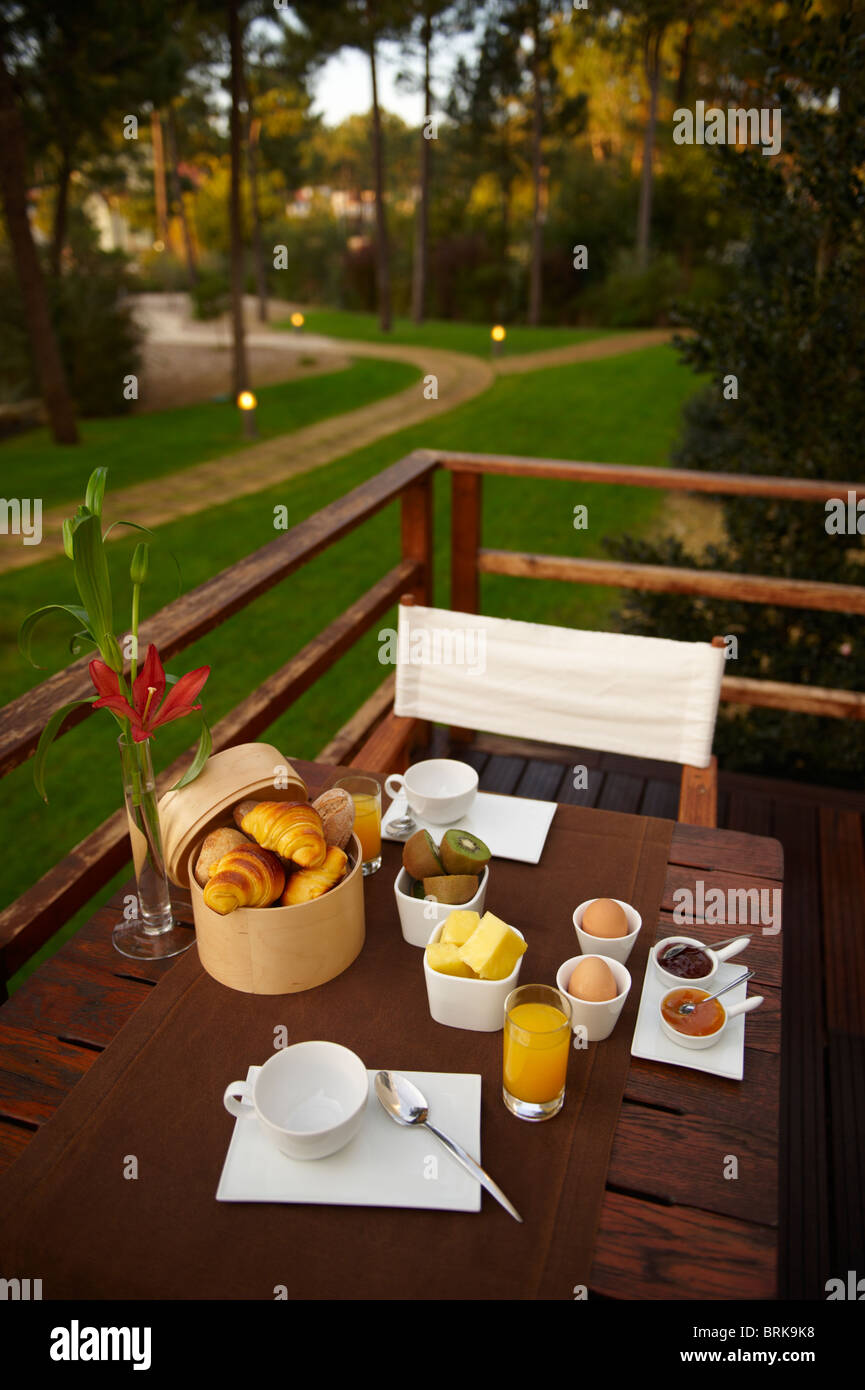 Breakfast on a balcony overseeing the woods Stock Photo - Alamy