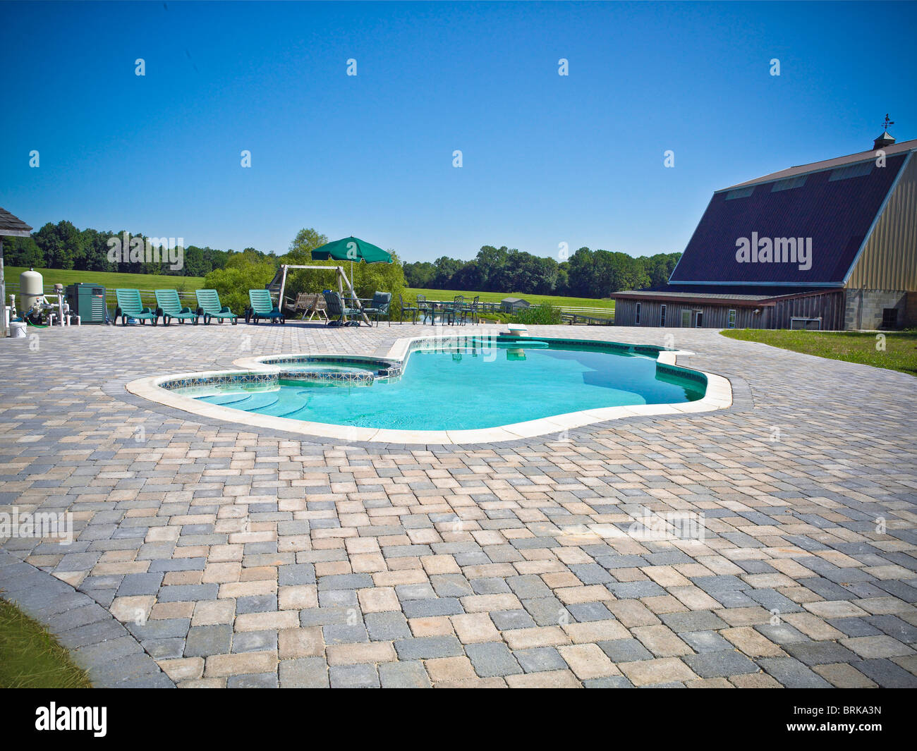 Brick stone patio swimming pool Stock Photo - Alamy