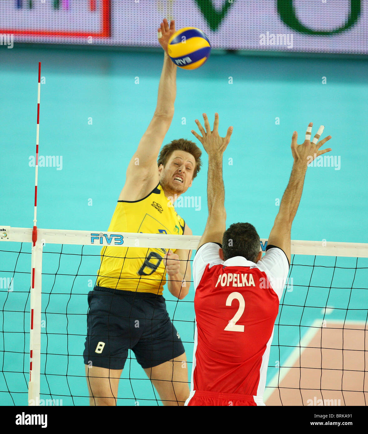 Endres Murilo (L) of Brazil spikes over Popelka Jiri of Czech Republic ...
