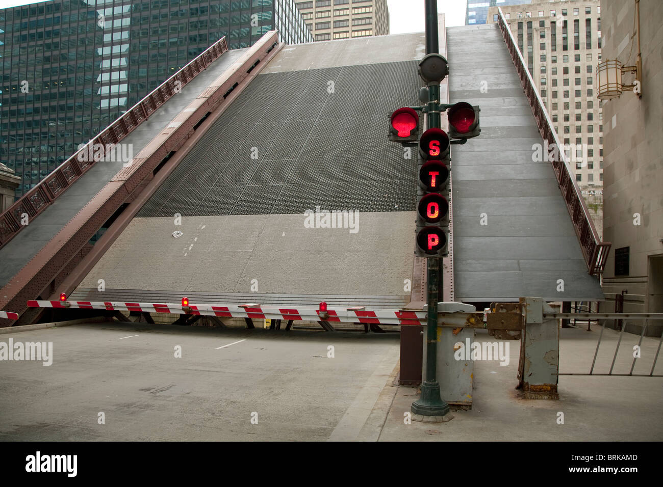 Stop sign at a raised bridge over the Chicago River at West Madison ...