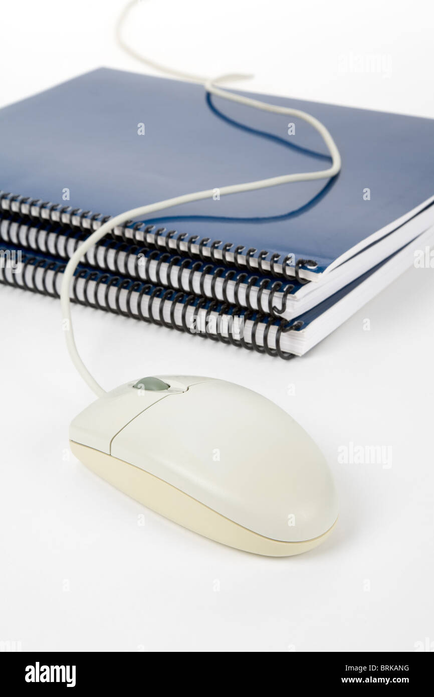 Blue school textbook and computer mouse, online learning Stock Photo ...