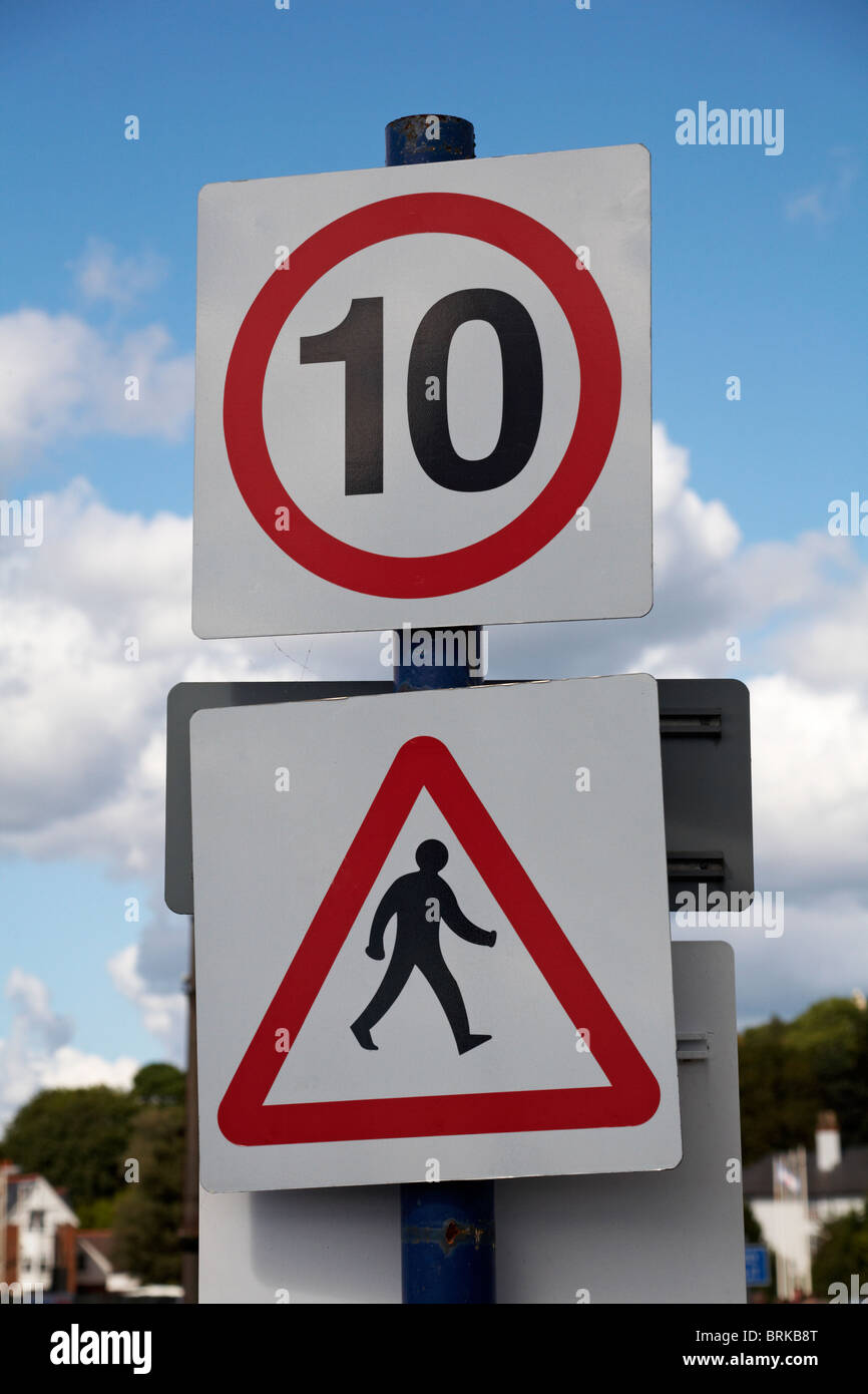 10 mph speed limit sign and pedestrians walking sign pedestrians ...