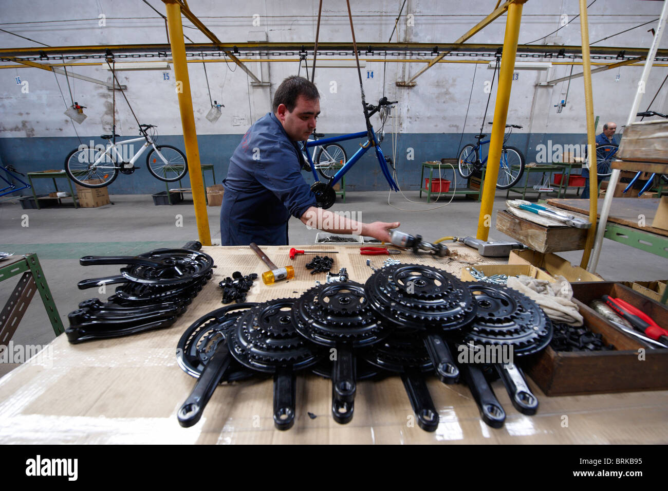 Worker at the assembly line of a bicycle factory Stock Photo - Alamy