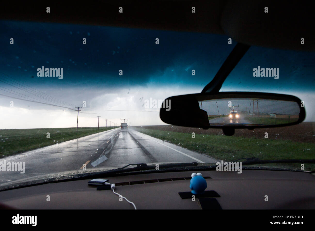 View form the dash of a storm chaser's vehicle as he closes in on a ...