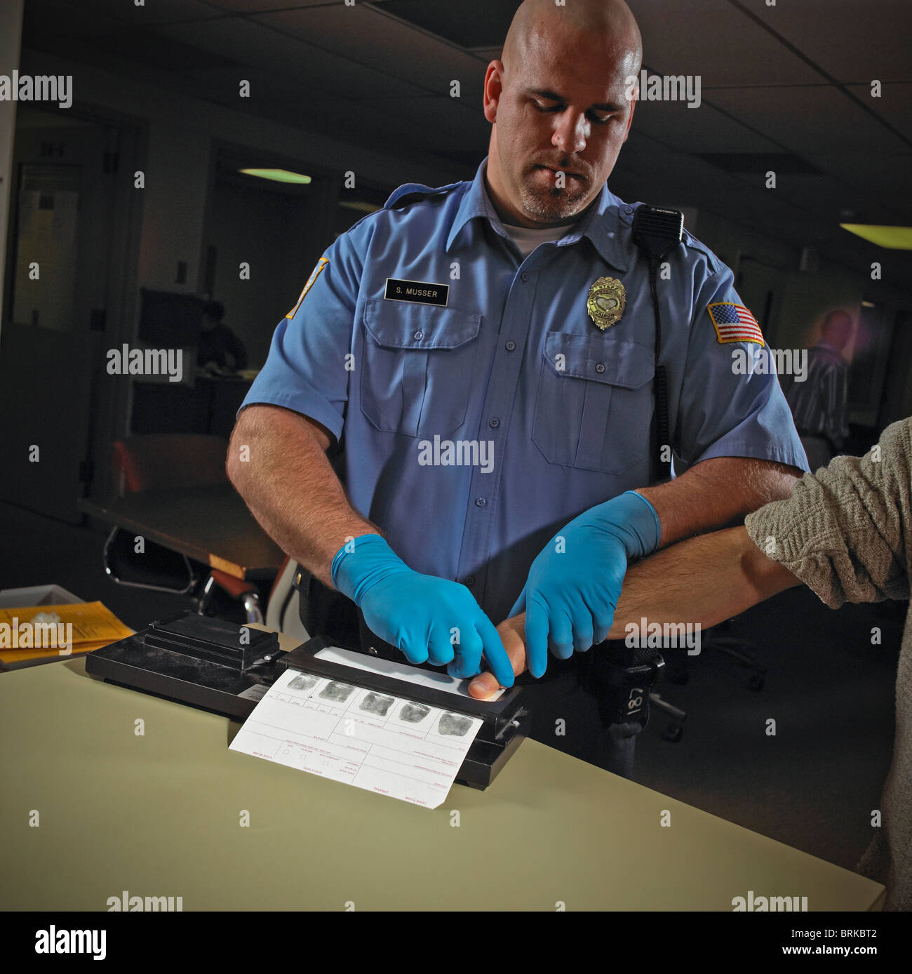 Police officer, security guard, fingerprints criminal suspect prisoner ...
