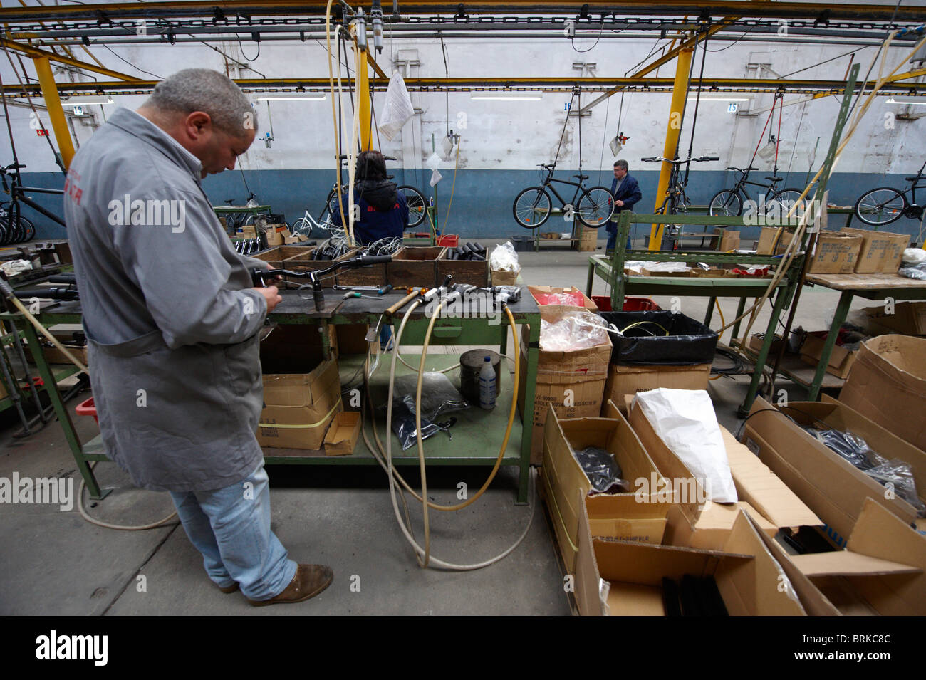 Workers at the assembly line of a bicycle factory Stock Photo - Alamy