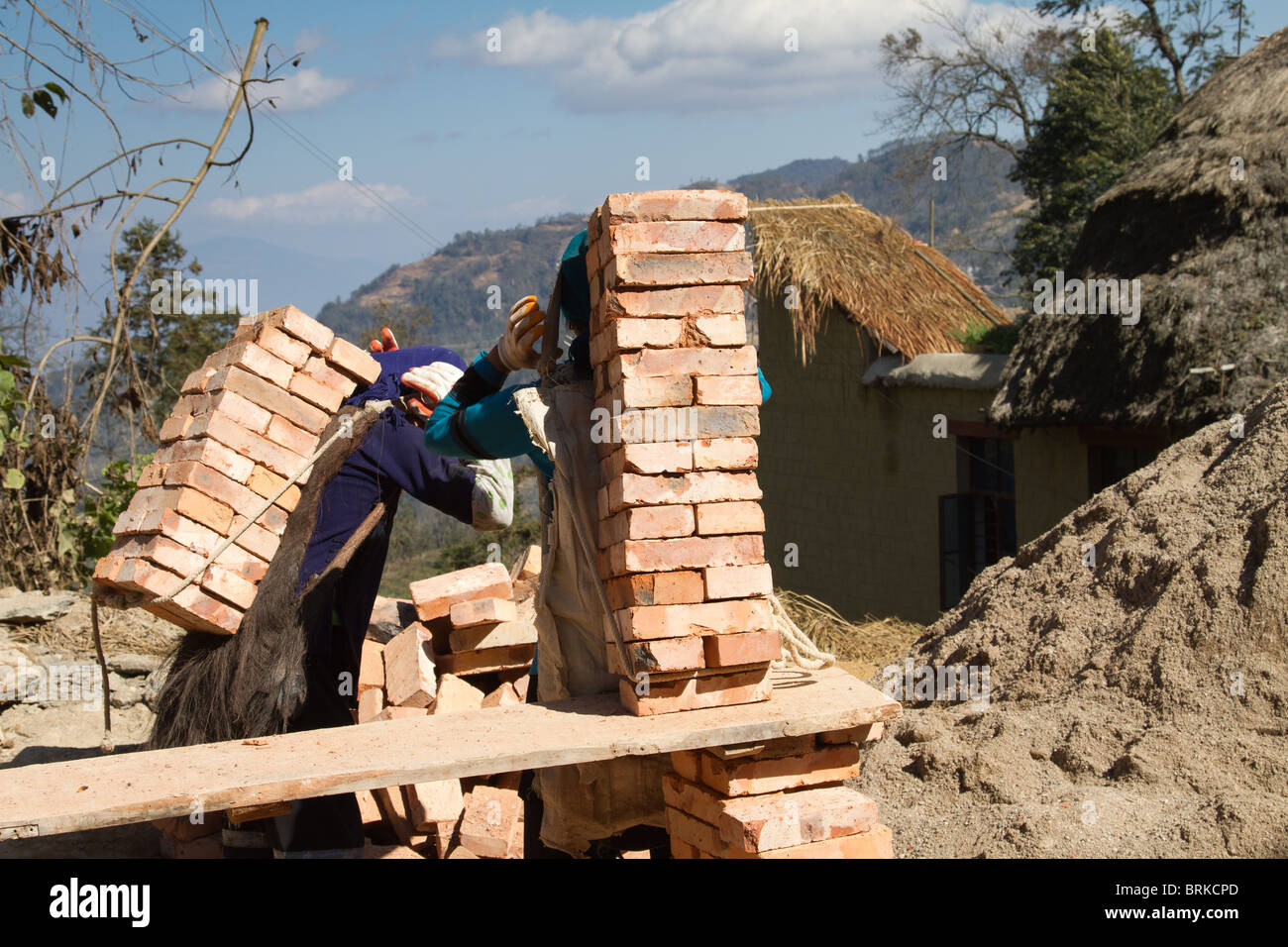 Women carrying bricks hi-res stock photography and images - Alamy