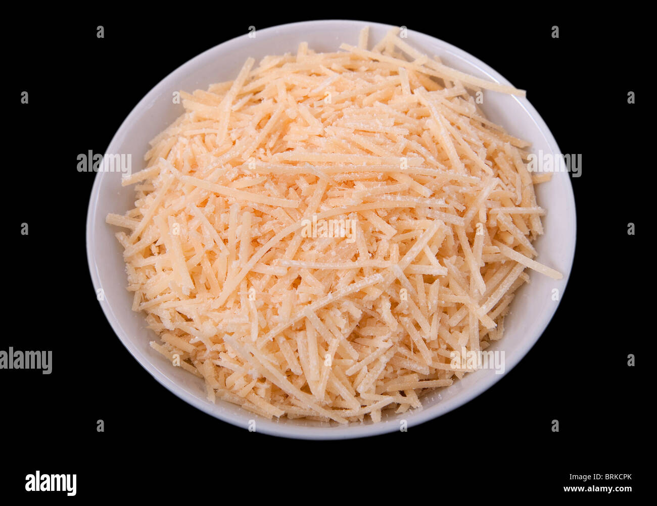 one small prep bowl of shredded cheddar cheese ready to cook with over ...