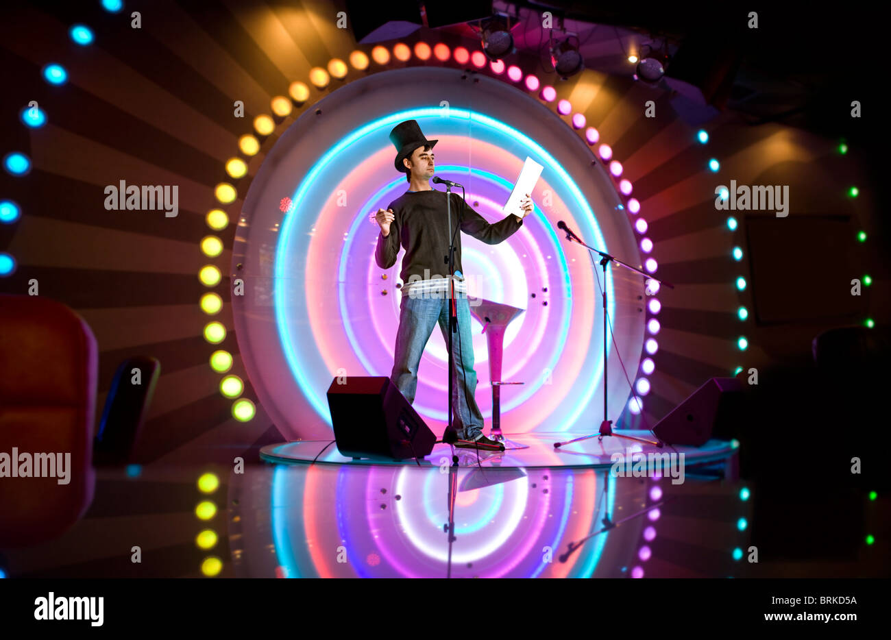 comedian with tile on stage of studio makes laugh of comedy show Stock ...