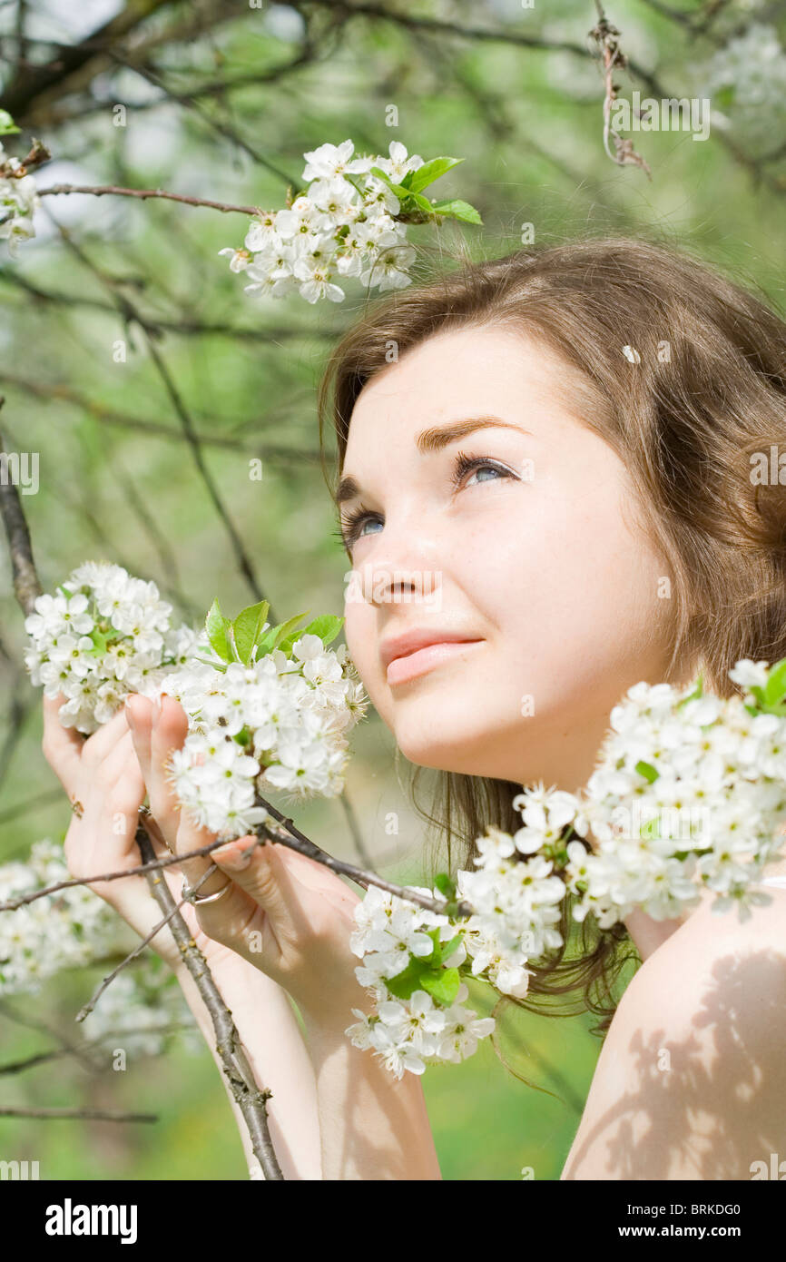 Woman with branch of blooming tree Stock Photo - Alamy