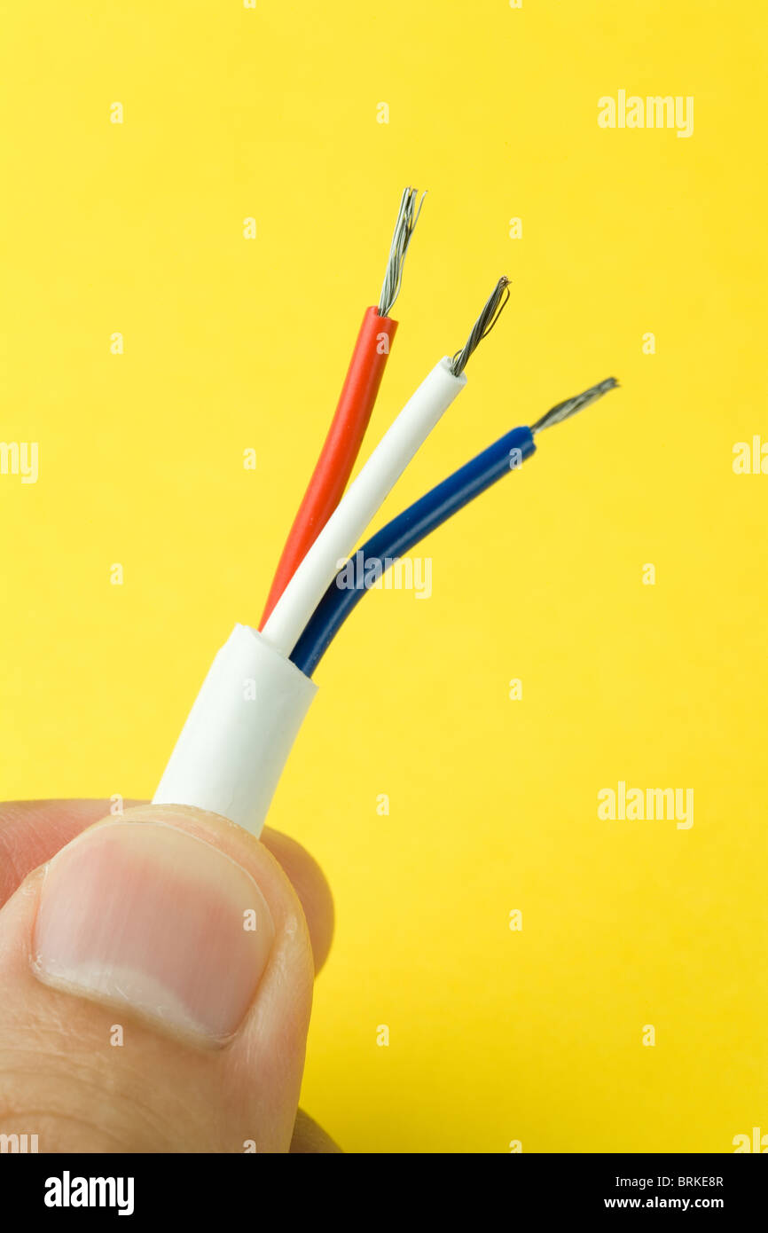 Electrical wire with yellow background Stock Photo - Alamy