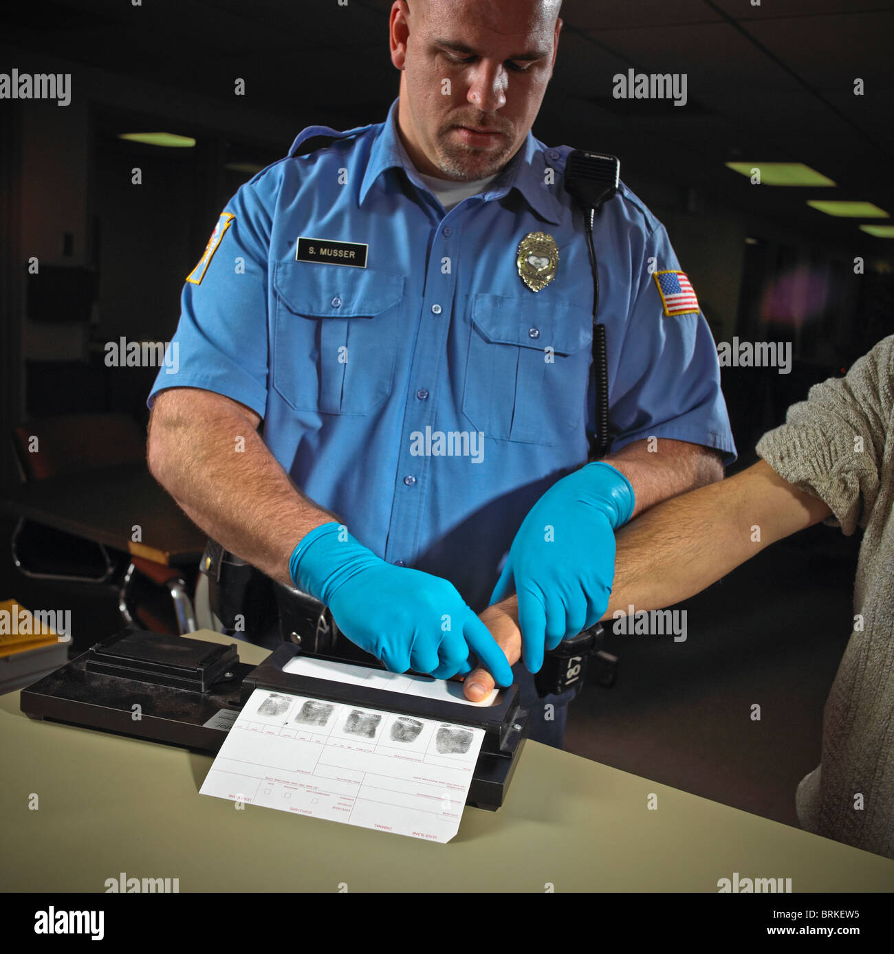 Police officer, security guard, fingerprints criminal suspect prisoner ...