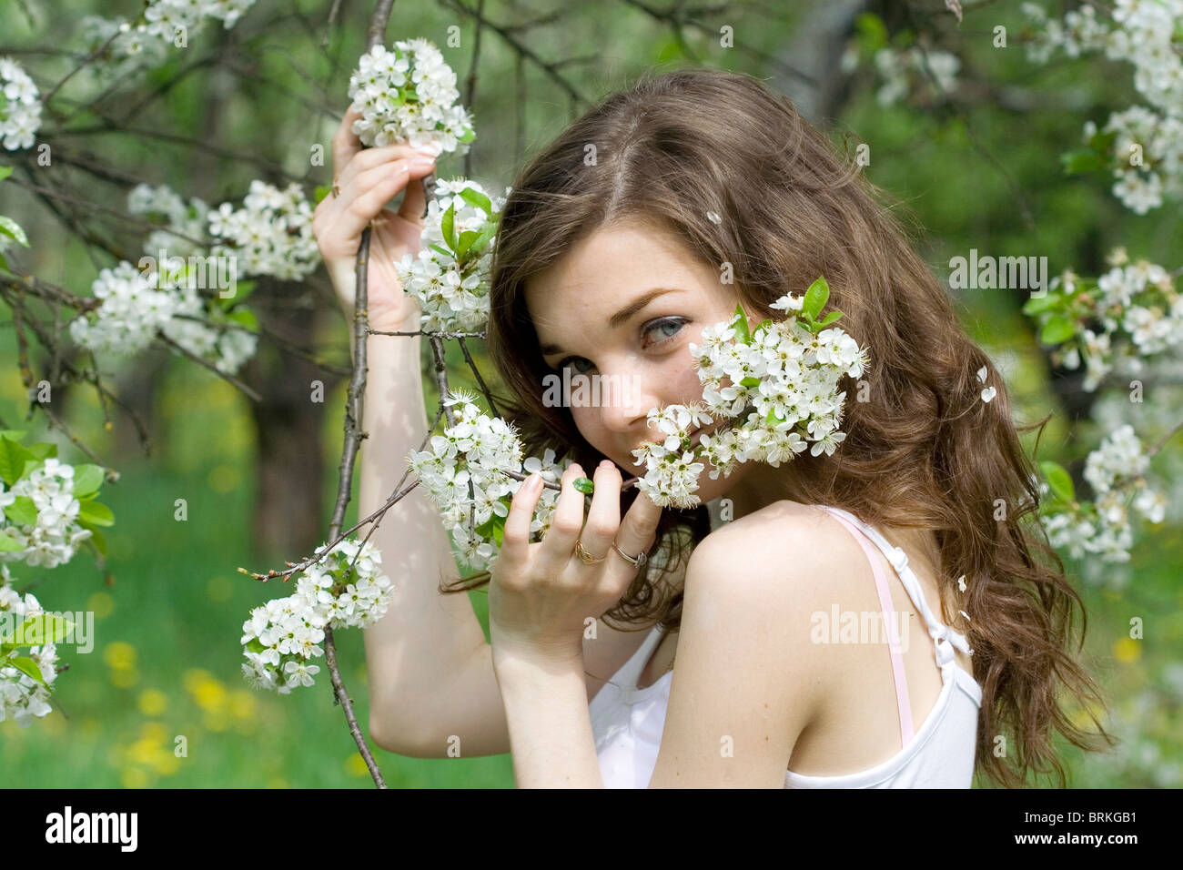 Woman with branch of blooming tree Stock Photo - Alamy