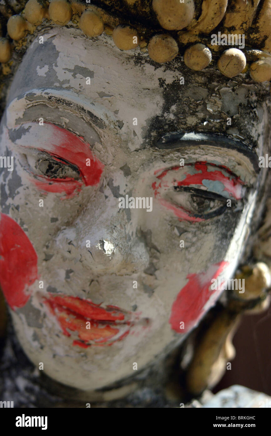 The face of a Buddhist statue is under repair at a temple in Chiang ...